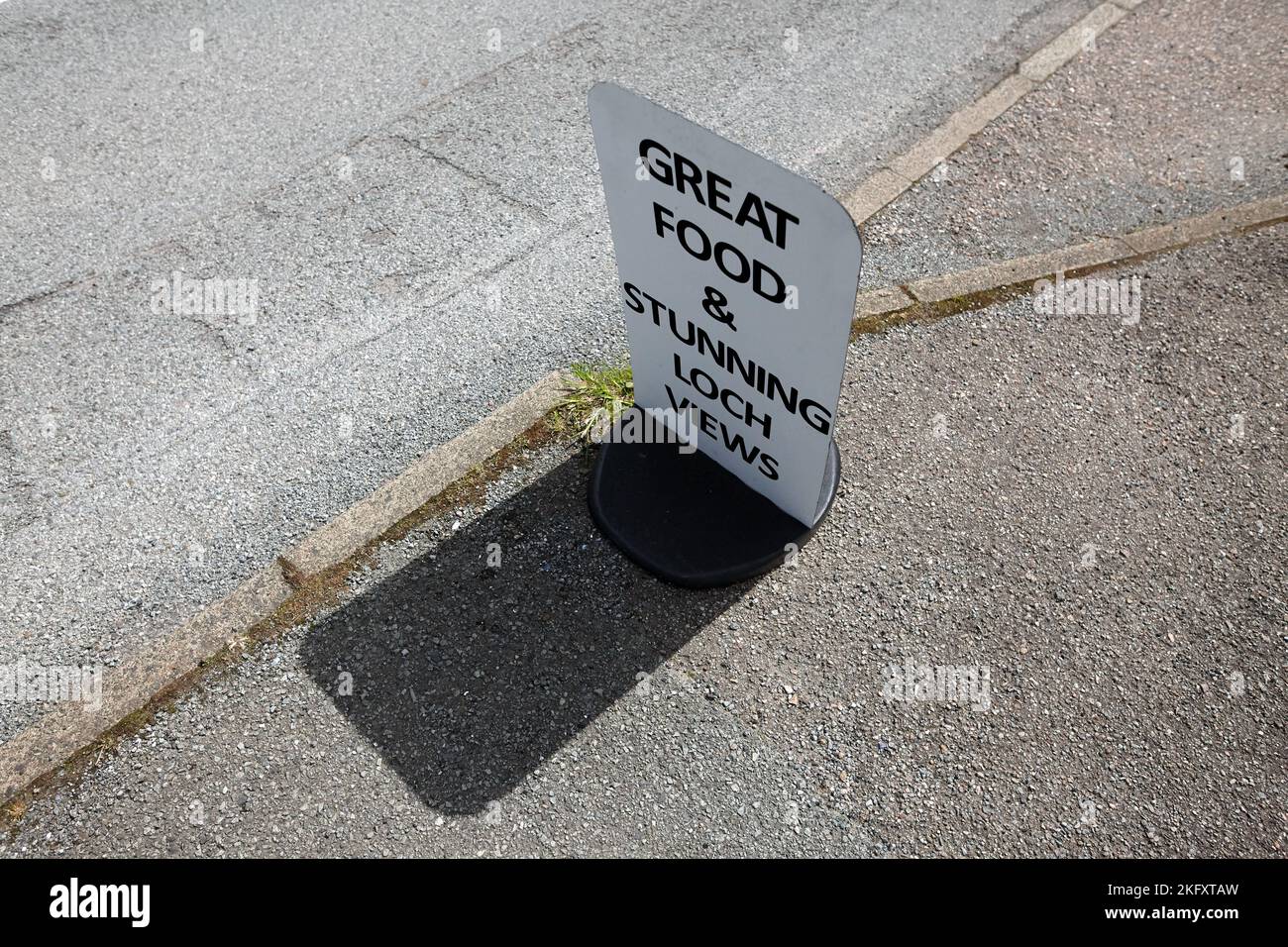 A white road sign for food restaurant with a stunning view Stock Photo ...