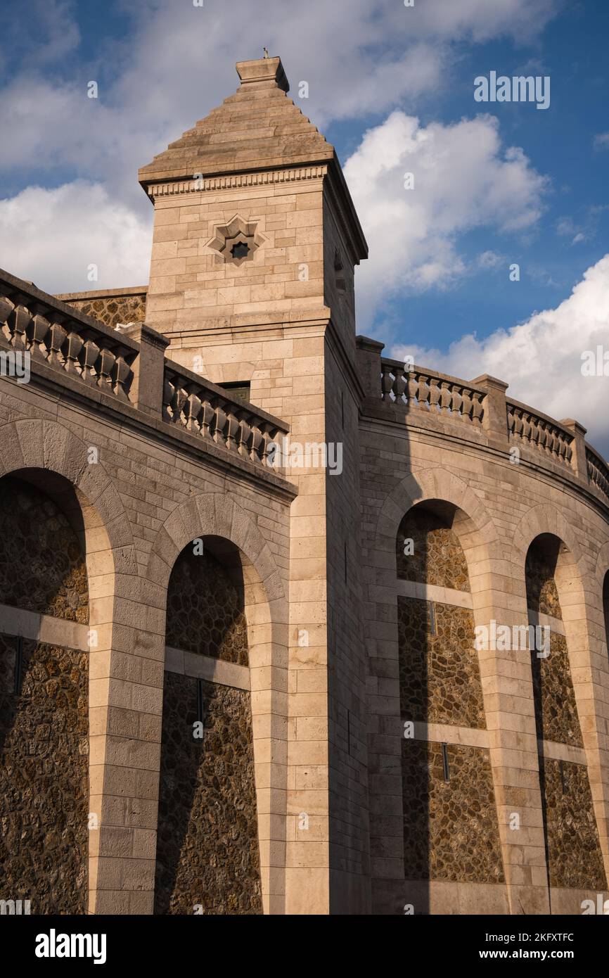 A vertical shot of the outer stone wall of Montmartre reservoir in ...