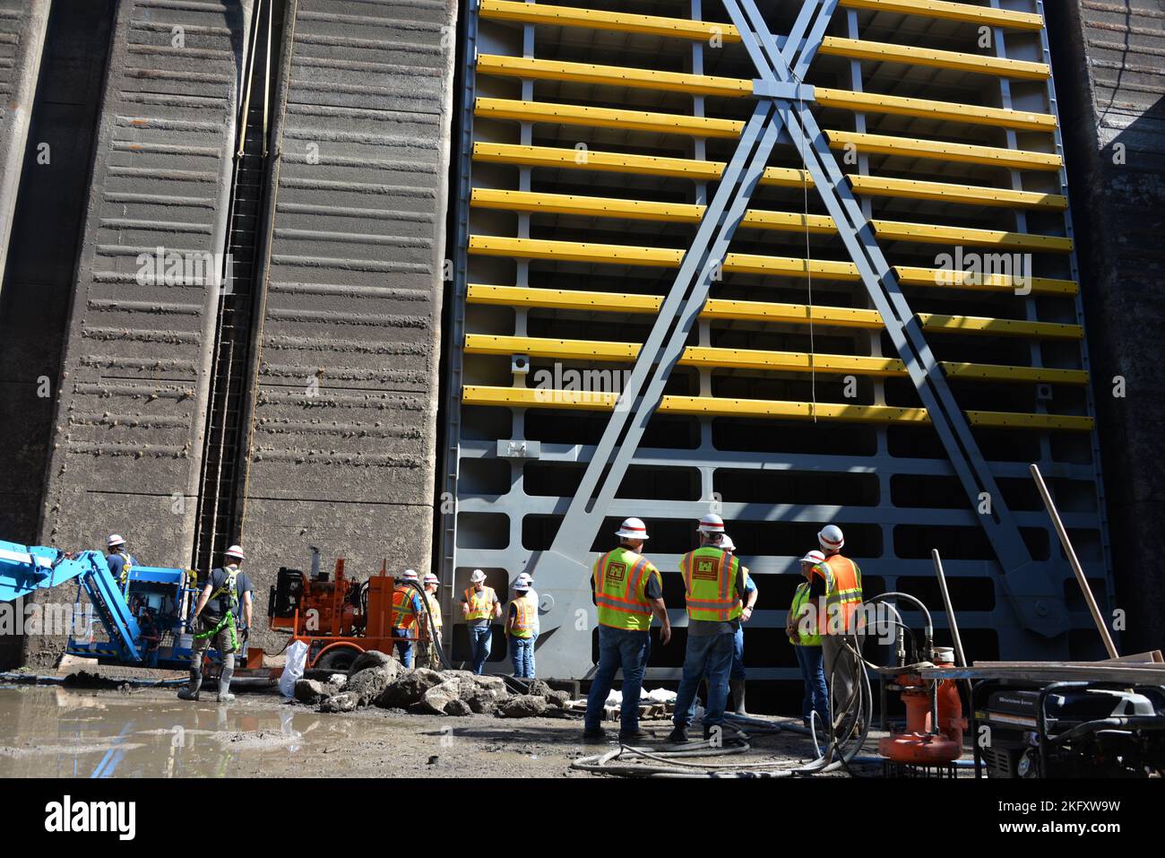 U.S. Army Corps of Engineers personnel inspect a new gate installed at ...