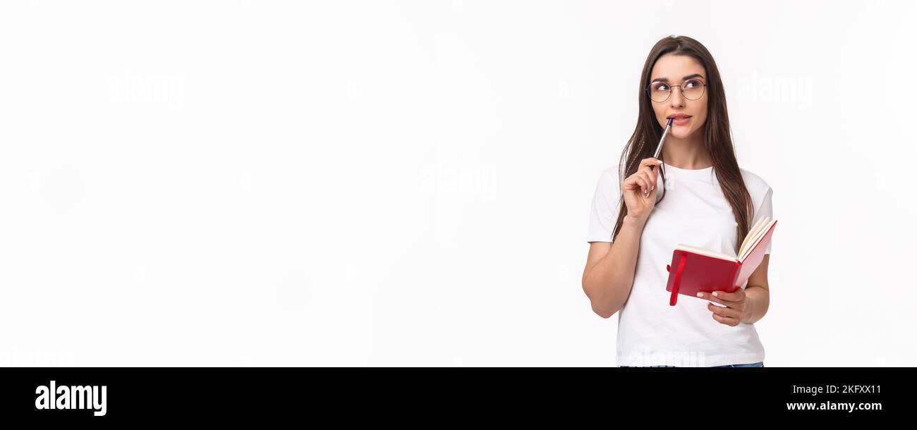 Portrait of creative and thoughtful gorgeous young woman making plans ...