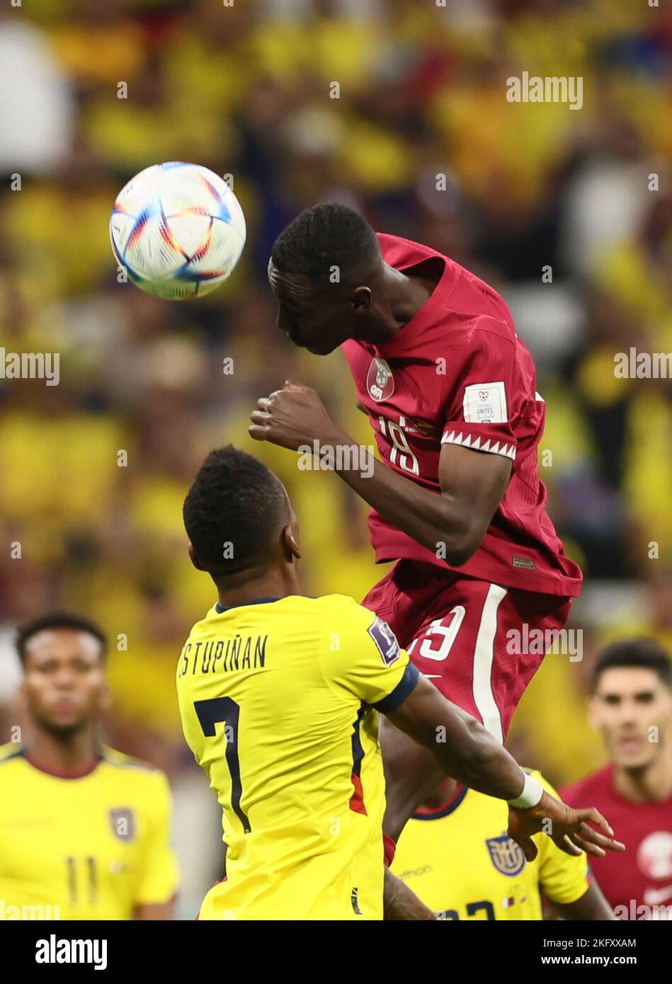 Al Khor, Qatar. 20th Nov, 2022. Almoez Ali (Top) of Qatar heads the ...