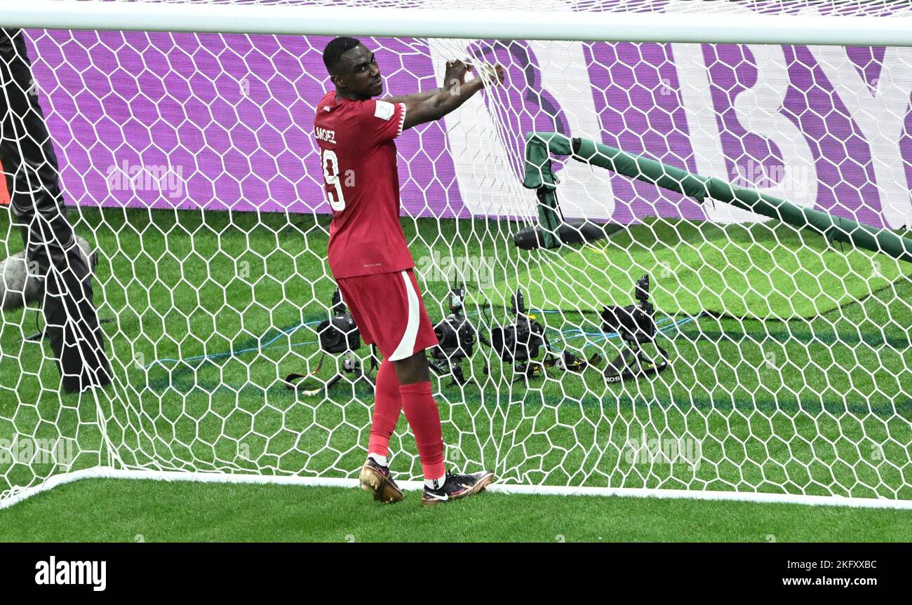 Al Khor, Qatar. 20th Nov, 2022. Almoez Ali of Qatar reacts after failed ...