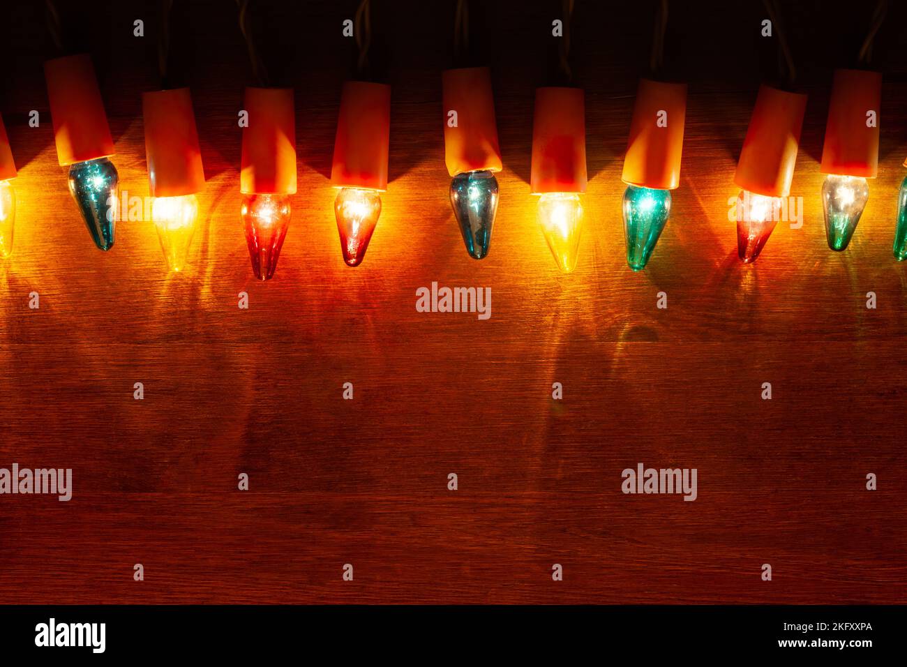 Christmas Lights - Retro light bulbs on wooden background with copy ...
