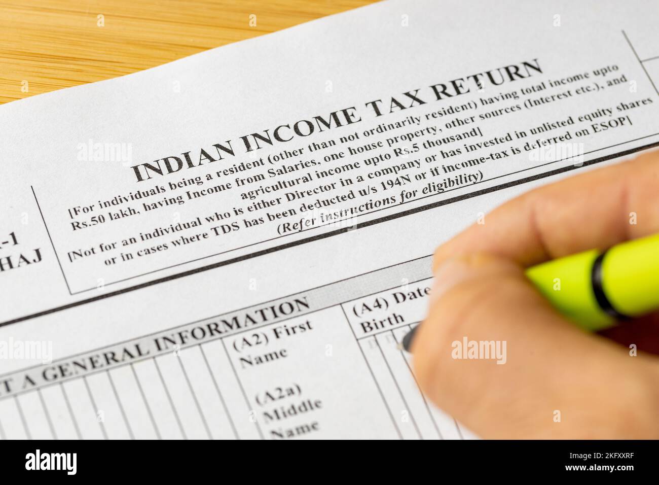 India income tax return, ITR1 form and hand with pen of person filling ...