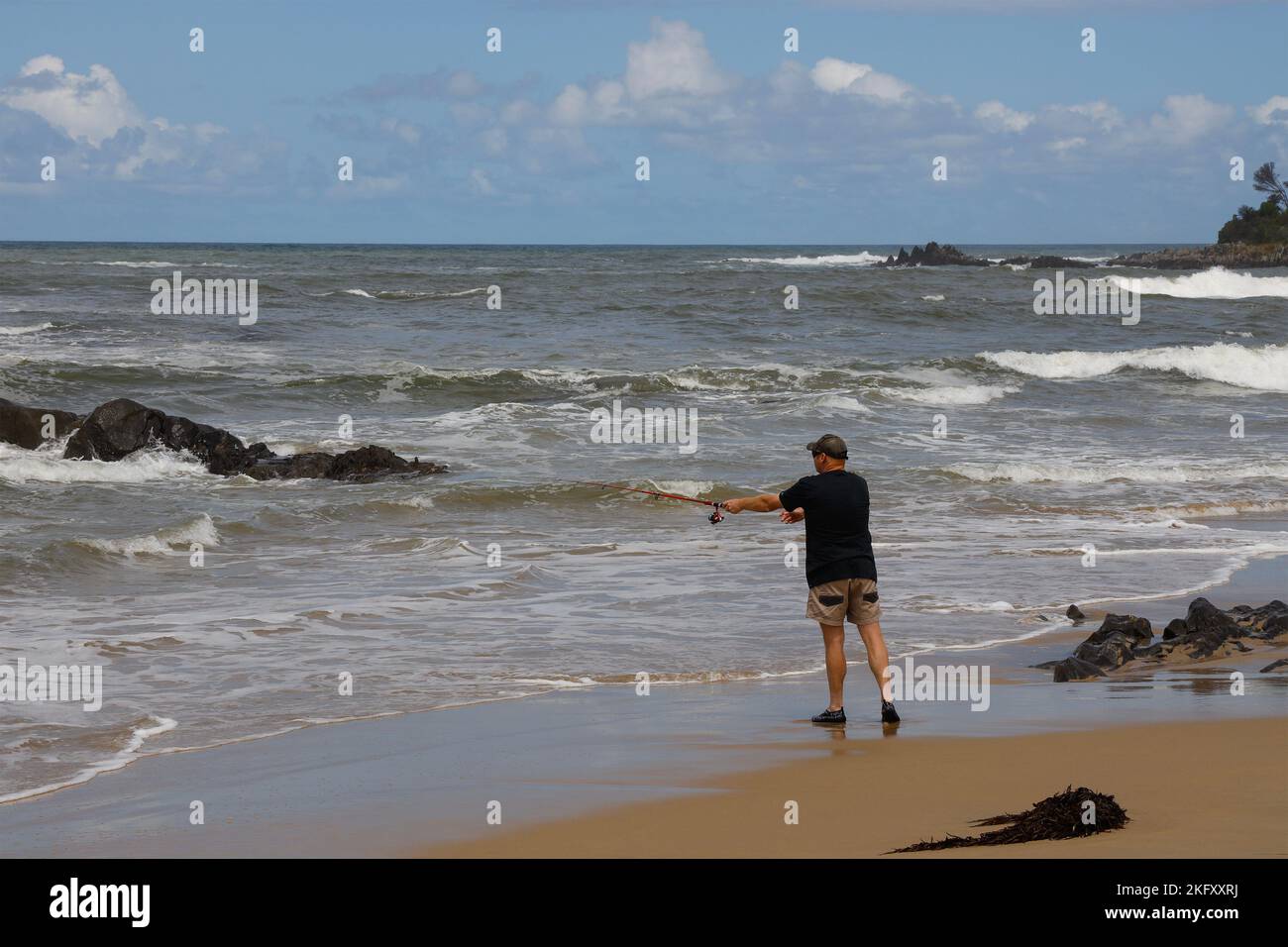 Angler fishing from the beach at Cape Conran Coastal Park, Victoria ...