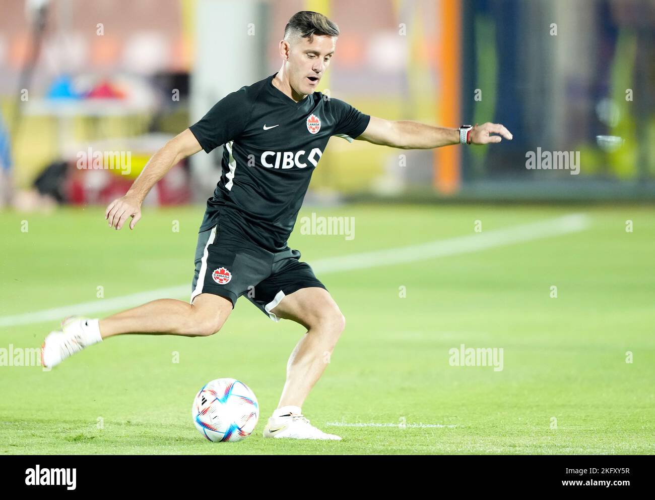 Canada head coach John Herdman kicks the ball during practice at the ...