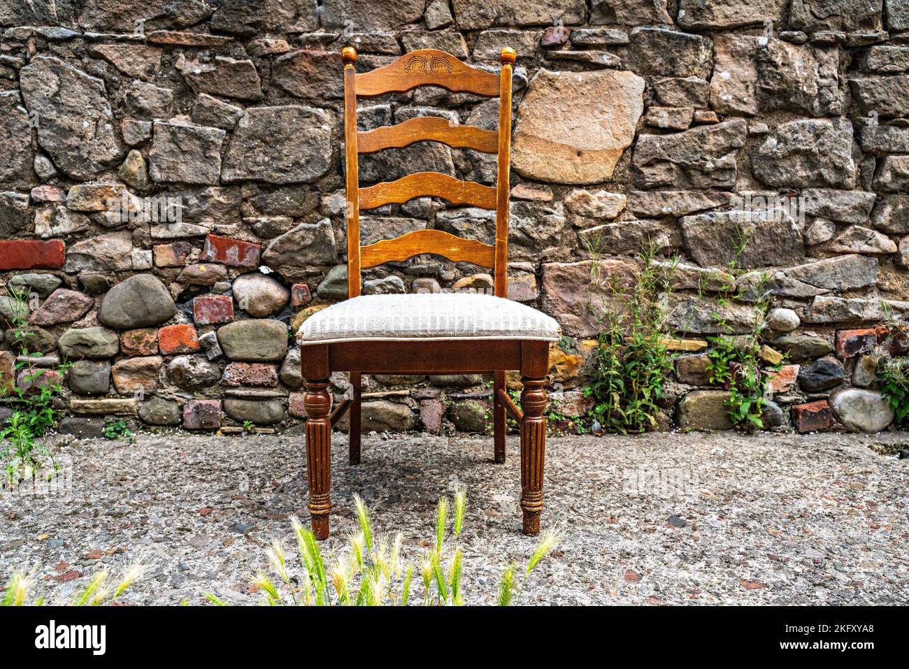 Wooden dining chair left in street Stock Photo - Alamy