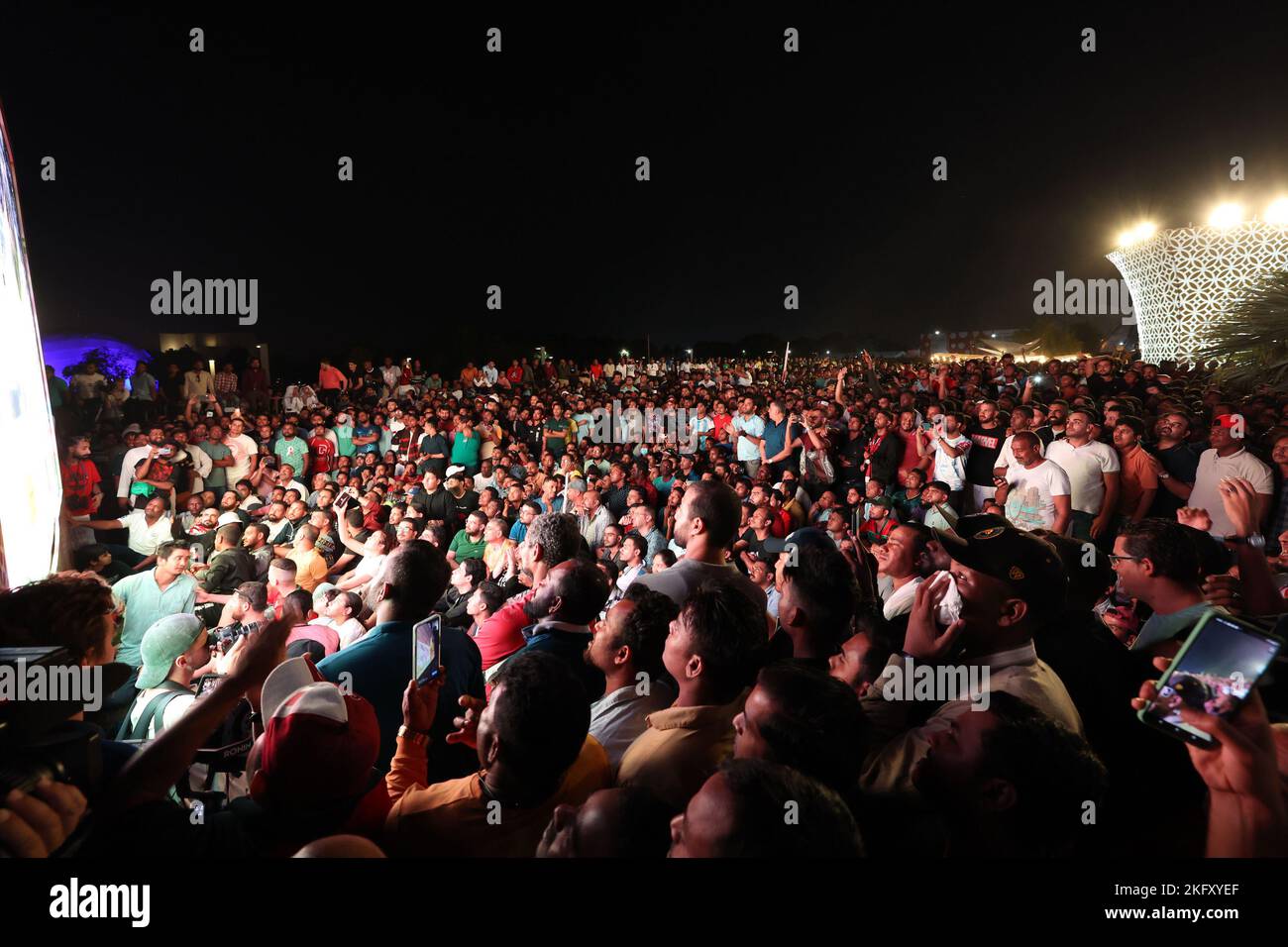 Doha, Qatar. 20th Nov, 2022. Fans watch the 2022 Qatar FIFA World Cup opening match between ...