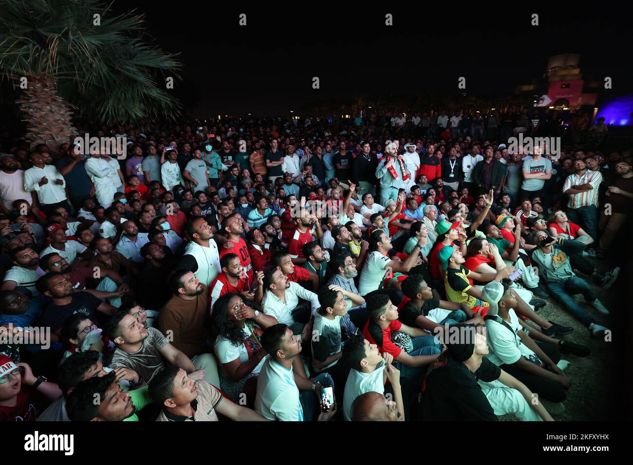 Doha, Qatar. 20th Nov, 2022. Fans watch the 2022 Qatar FIFA World Cup opening match between ...