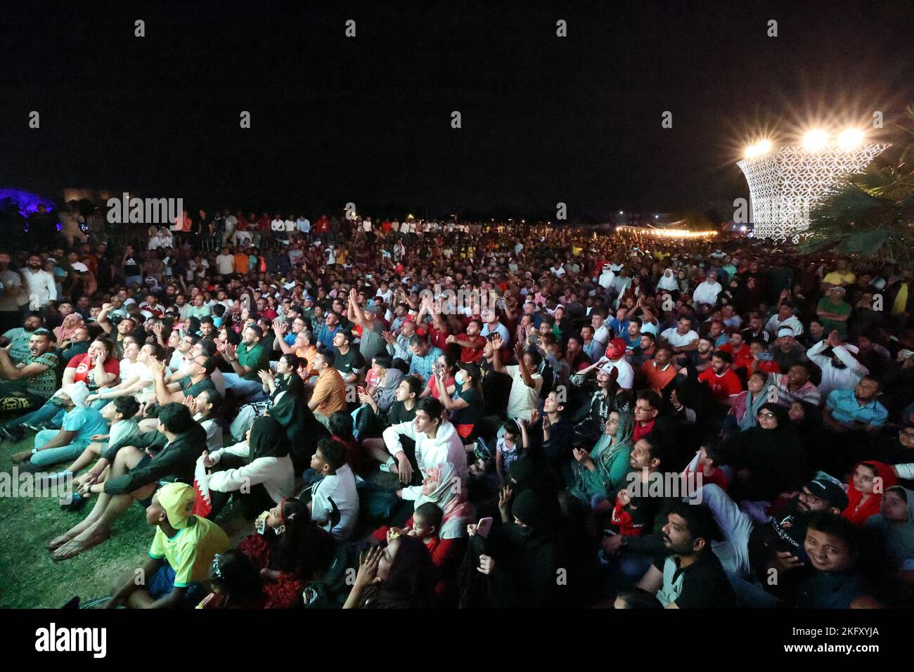 Doha, Qatar. 20th Nov, 2022. Fans watch the 2022 Qatar FIFA World Cup opening match between ...