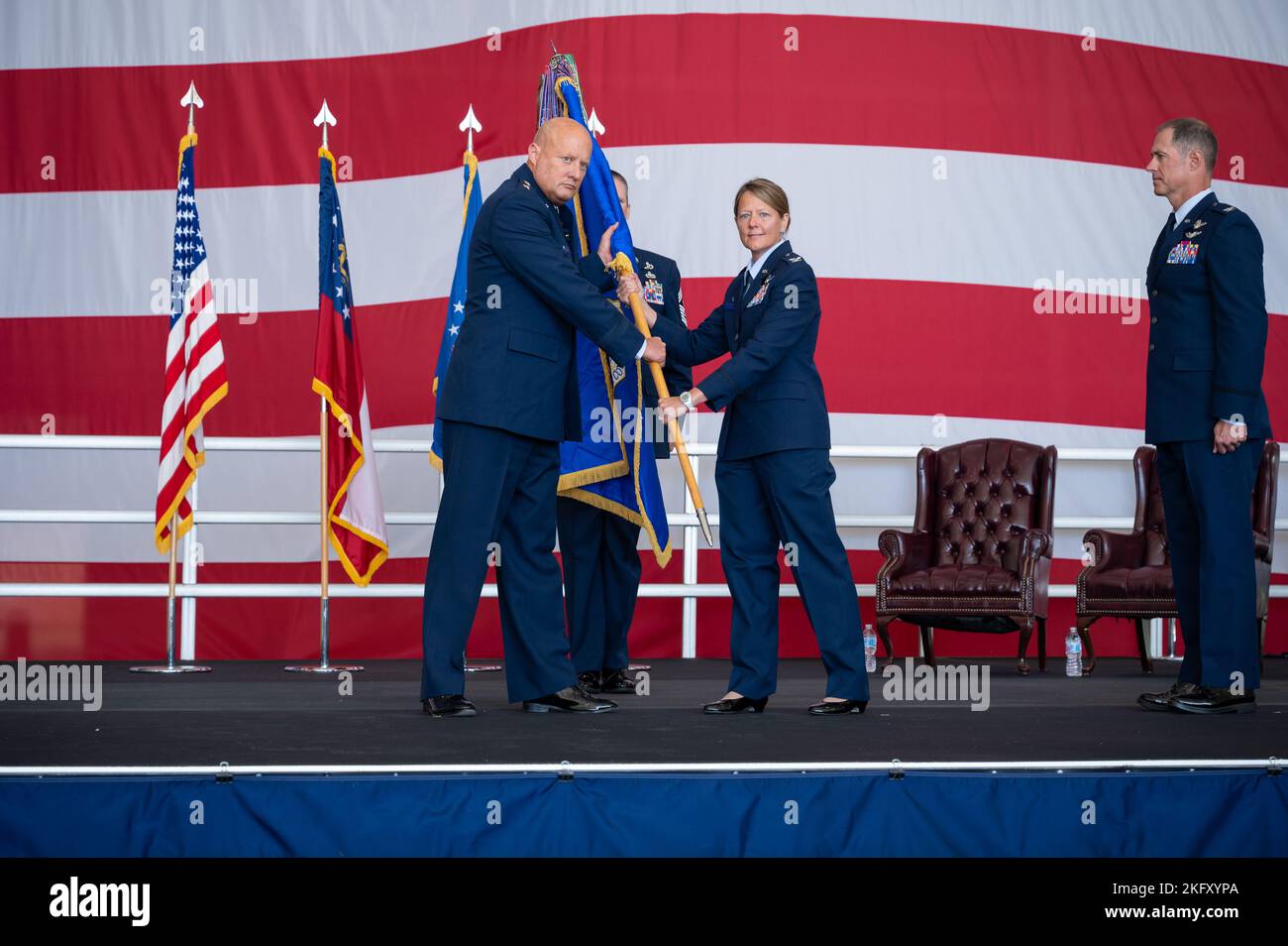 U.S. Air Force Col. Amy Holbeck, center, outgoing commander of the ...