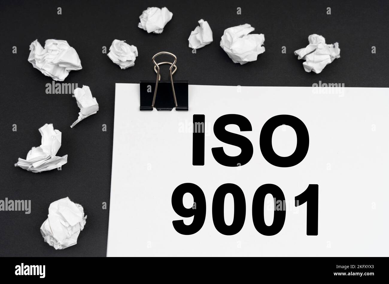 Industrial concept. On a black background, there are crumpled pieces of ...