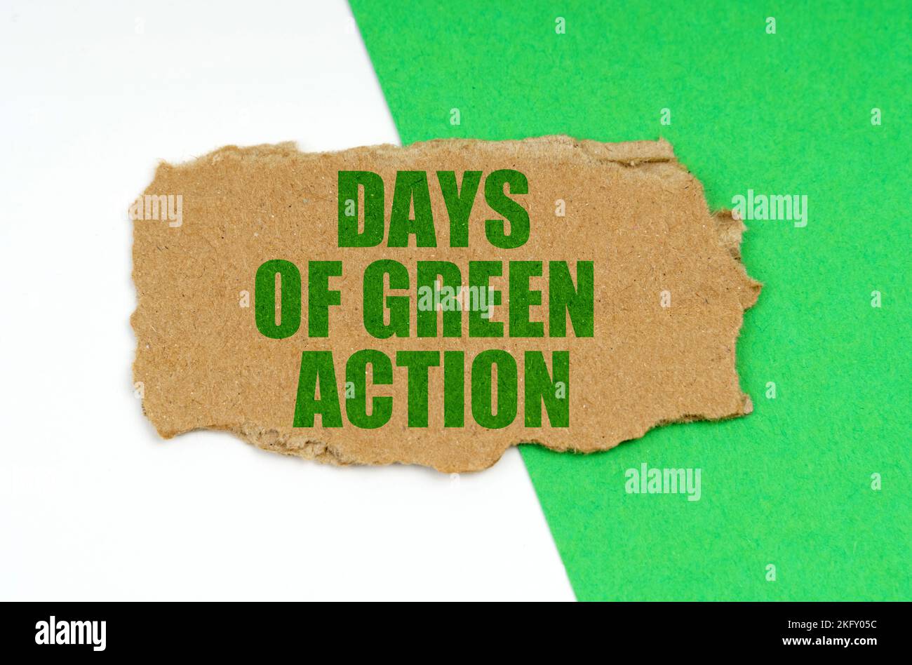 Environmental concept. On a white-green background lies a piece of ...