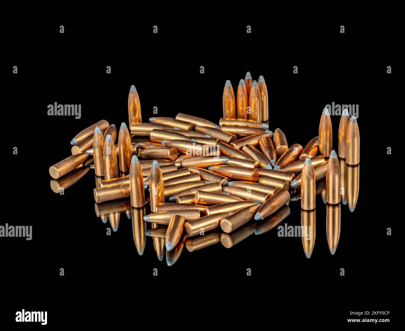 Assortment of bullets on a black surface for a high powered rifle Stock ...
