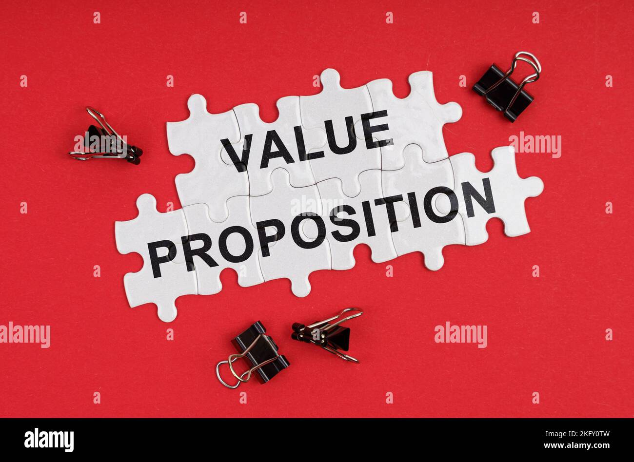 Business and Economics. On a red background, there are puzzles with the ...