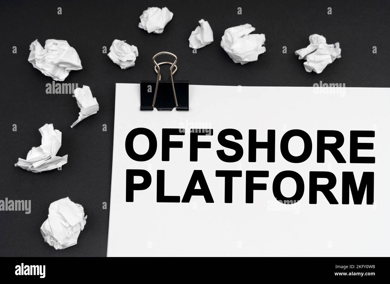 Industrial concept. On a black background, there are crumpled pieces of ...