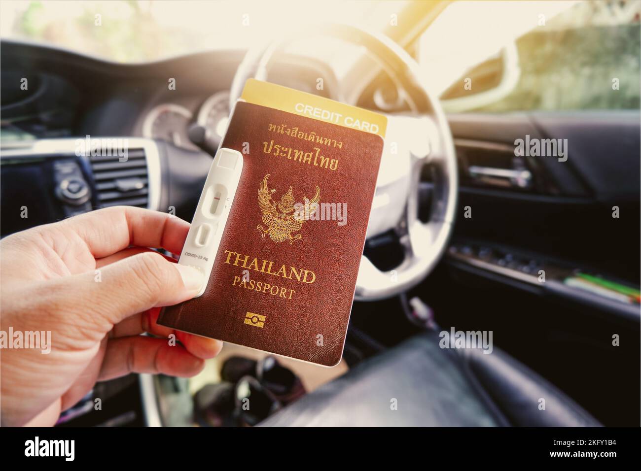 Tourist hand holding Thailand passport, credit card, covid-19 negative ...