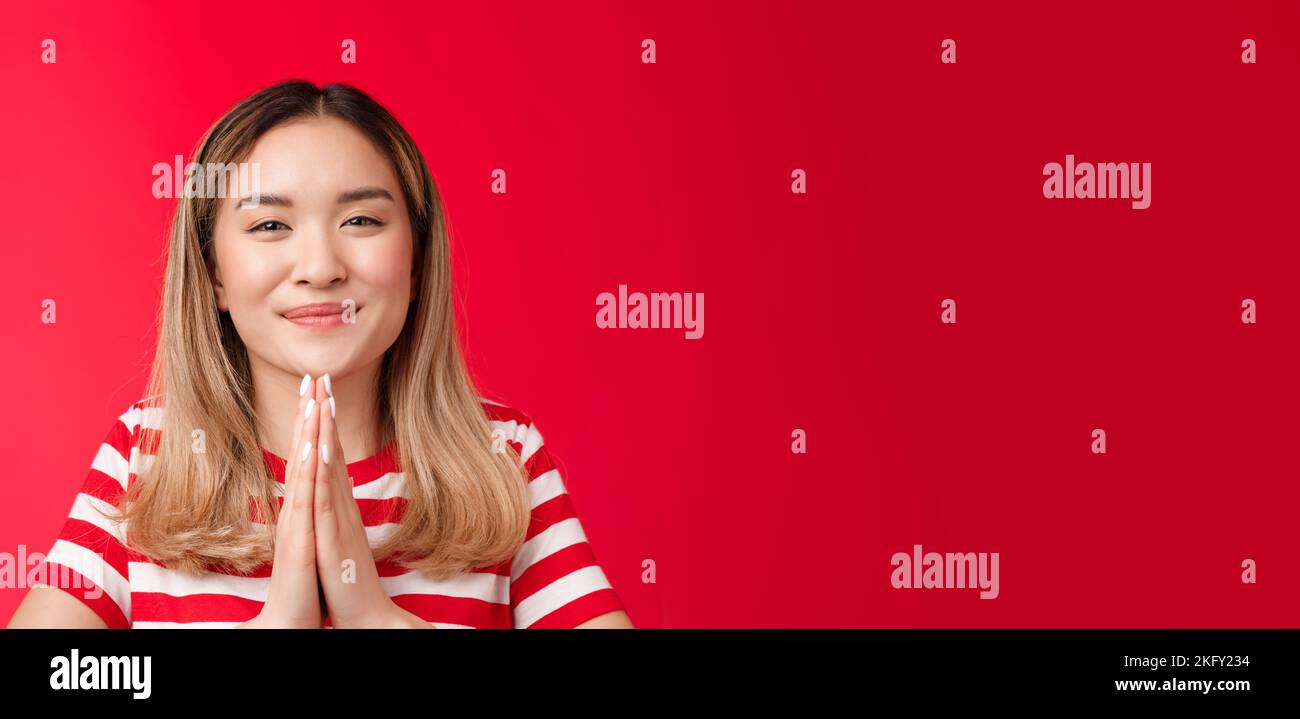 Thankful cute happy asian girl bowing politely show namaste gesture ...