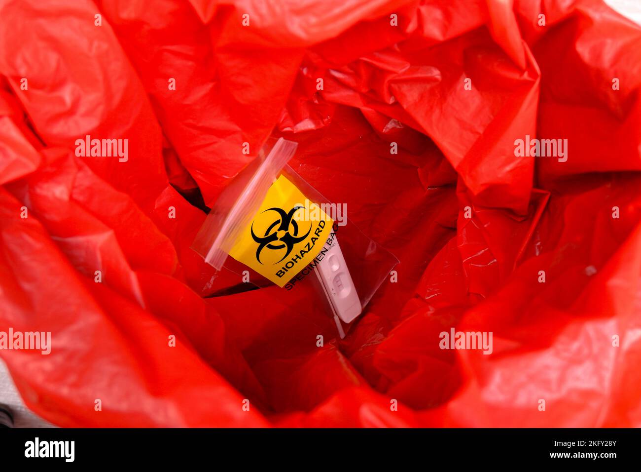 Infectious biohazard specimen bag of covid-19 test in the red ...