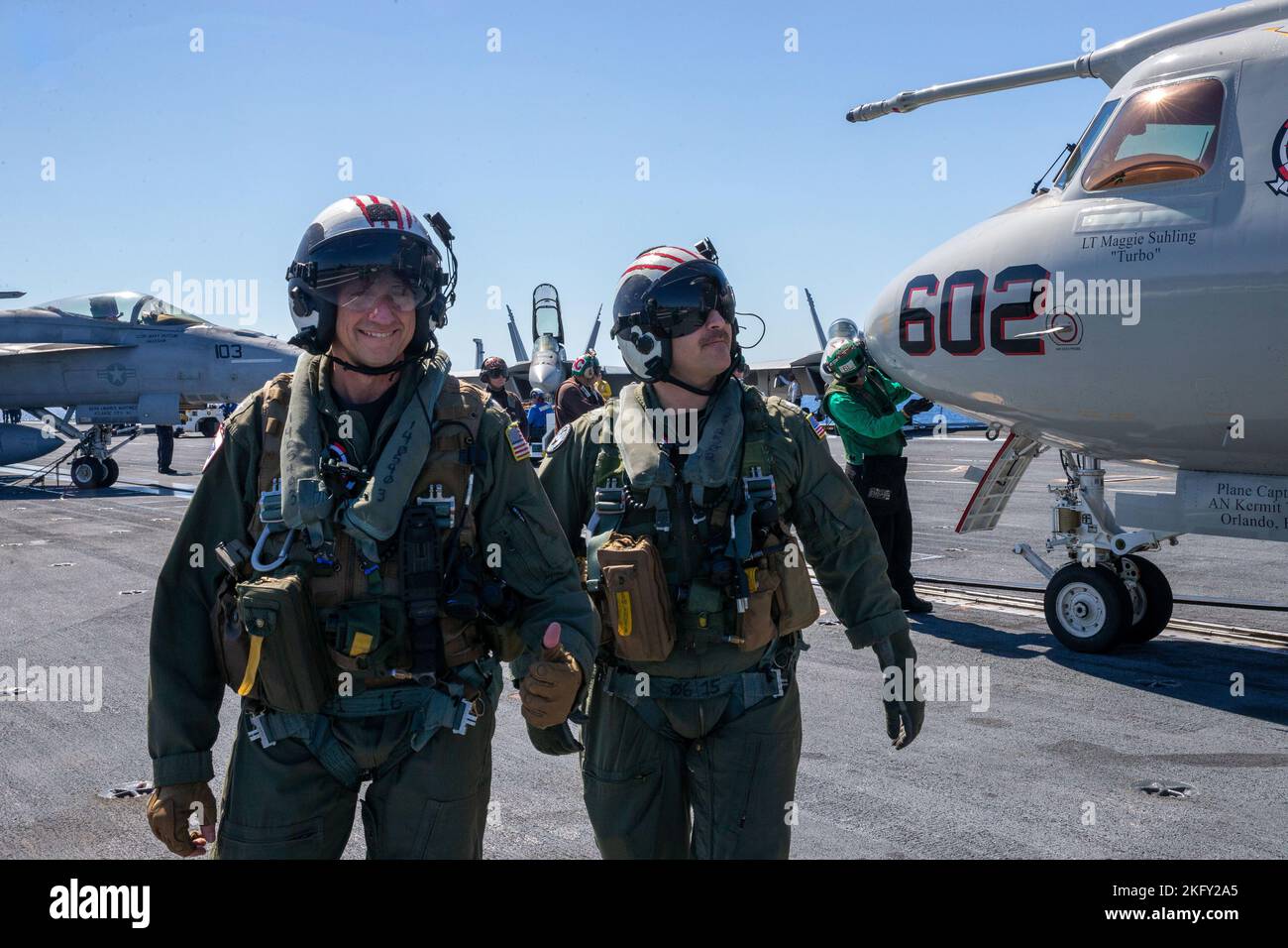 Rear Adm. Greg Huffman, left, commander, Carrier Strike Group (CSG) 12 ...