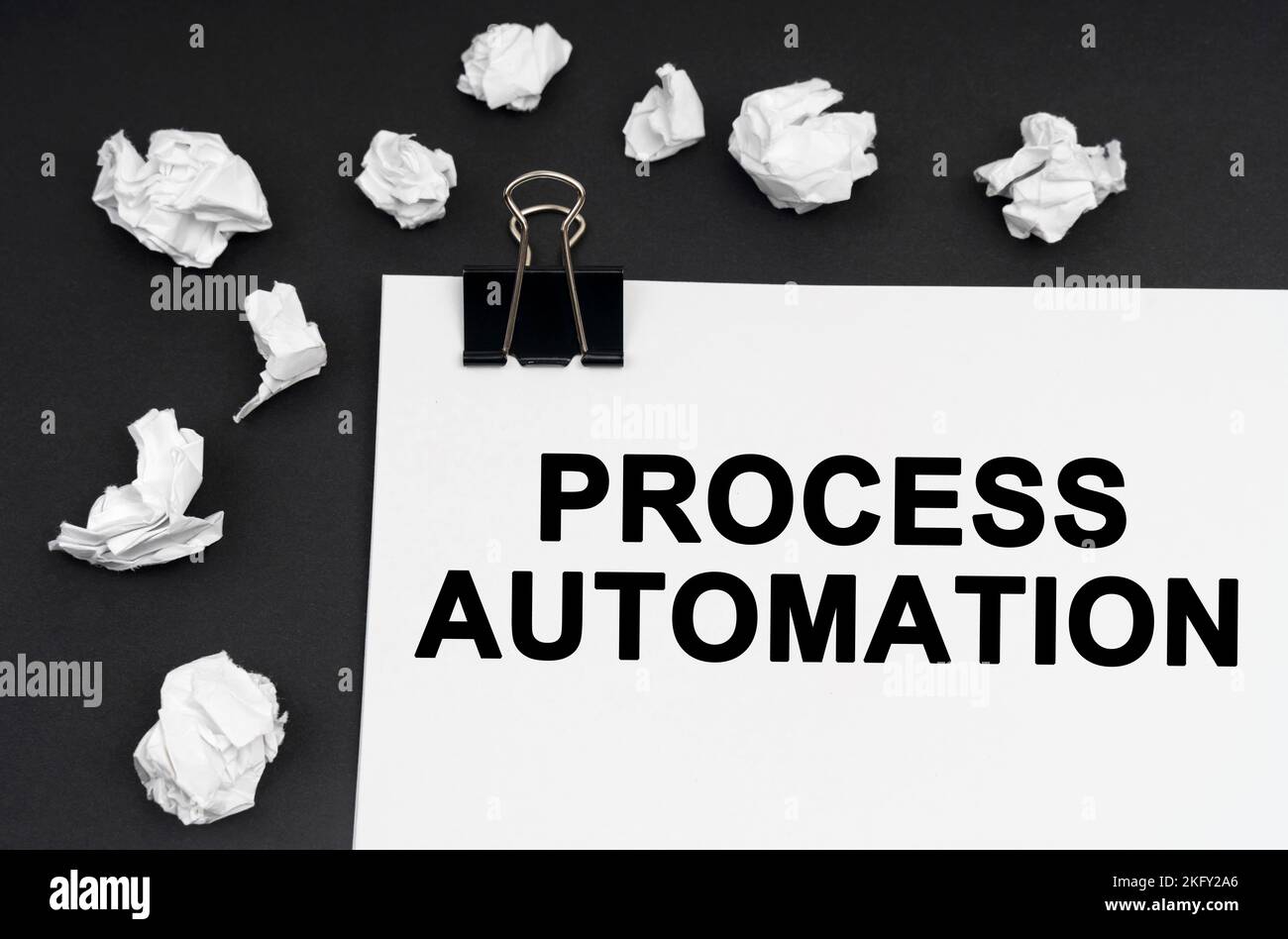 Industrial concept. On a black background, there are crumpled pieces of ...