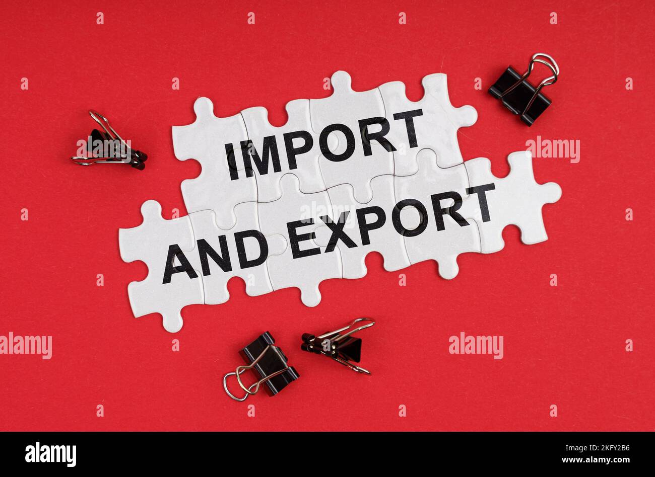 Business and Economics. On a red background, there are puzzles with the ...