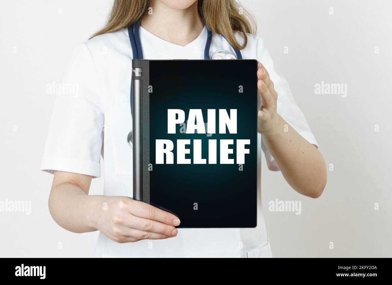 Medicine and health concept. The doctor is holding a tablet with the ...