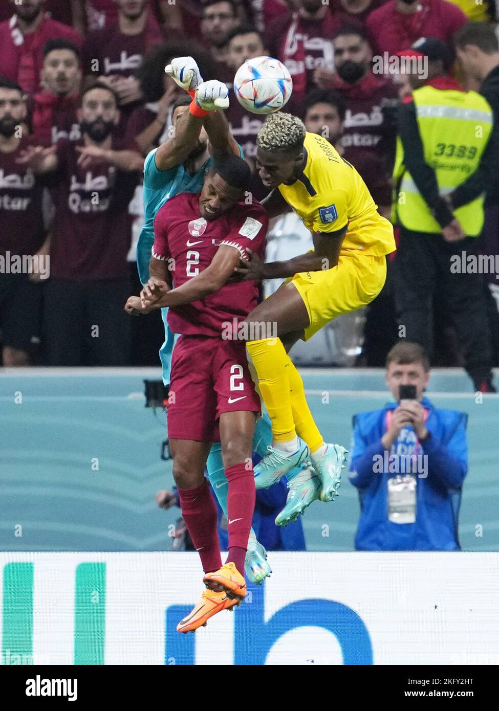 Al Khor, Qatar. 20th Nov, 2022. Pedro Miguel (C) of Qatar heads the ...