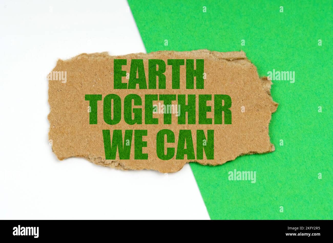 Environmental concept. On a white-green background lies a piece of ...