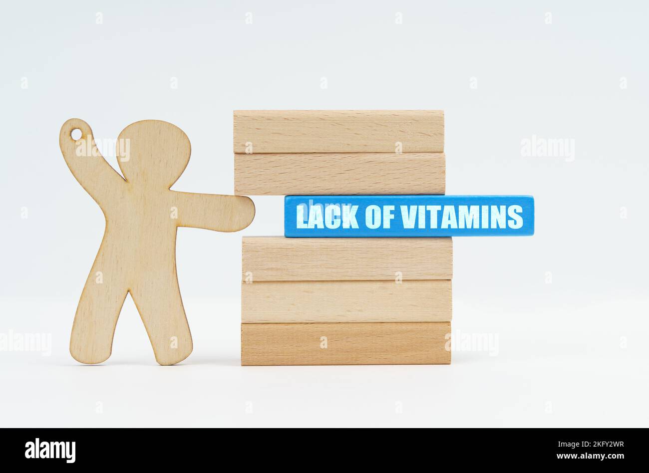 Medicine and healthcare concept. A human figurine pushes a blue wooden ...