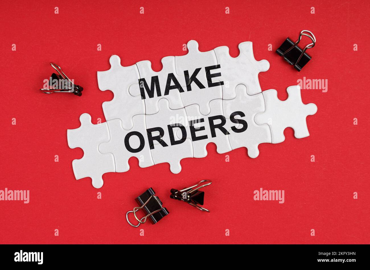 Business and Economics. On a red background, there are puzzles with the ...