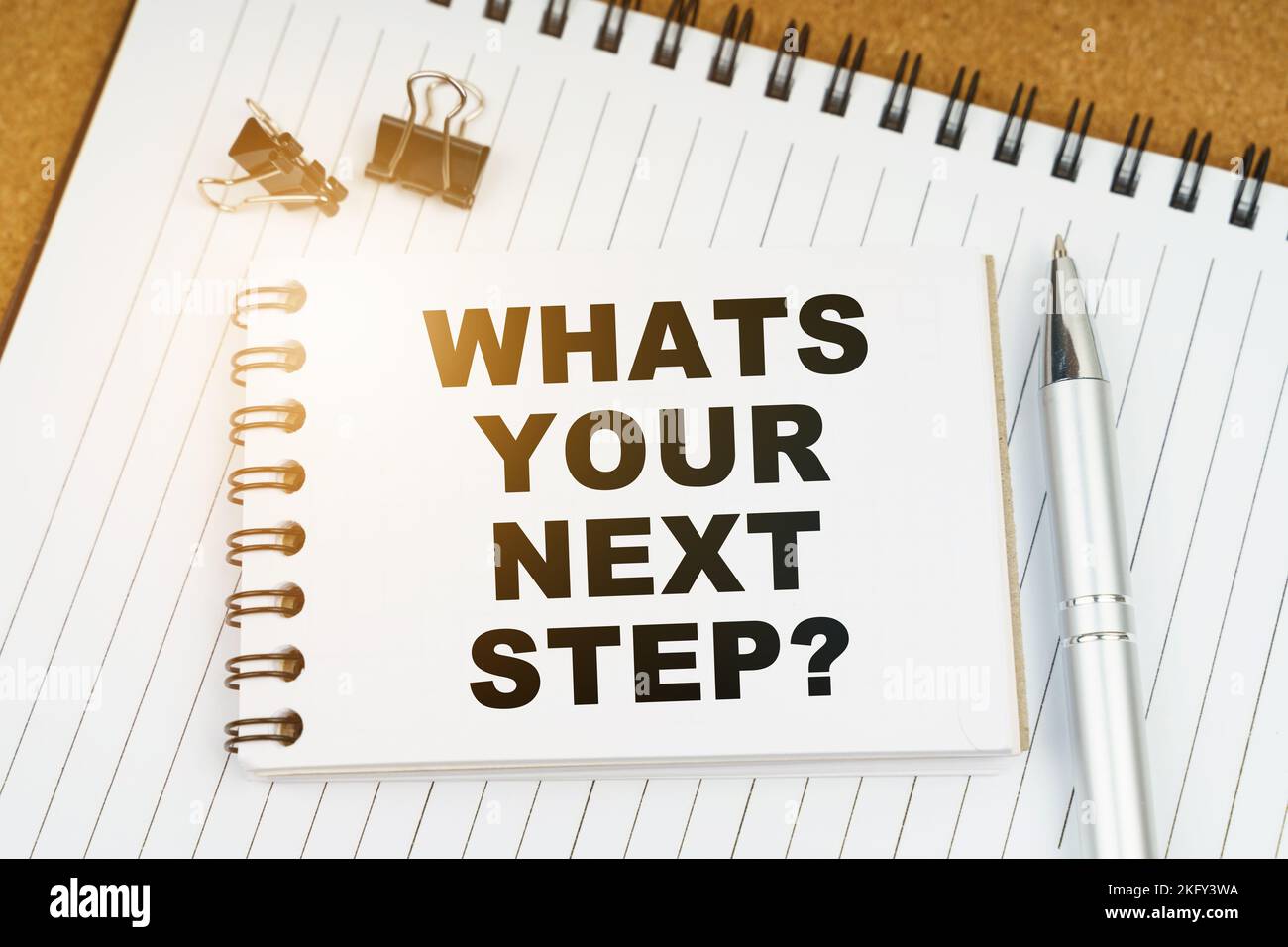 Economy and business concept. On the table there is a pen, clamps and a ...