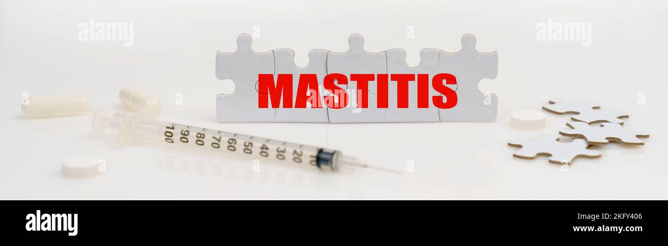 Medicine and health concept. On a white background lie a syringe, pills ...