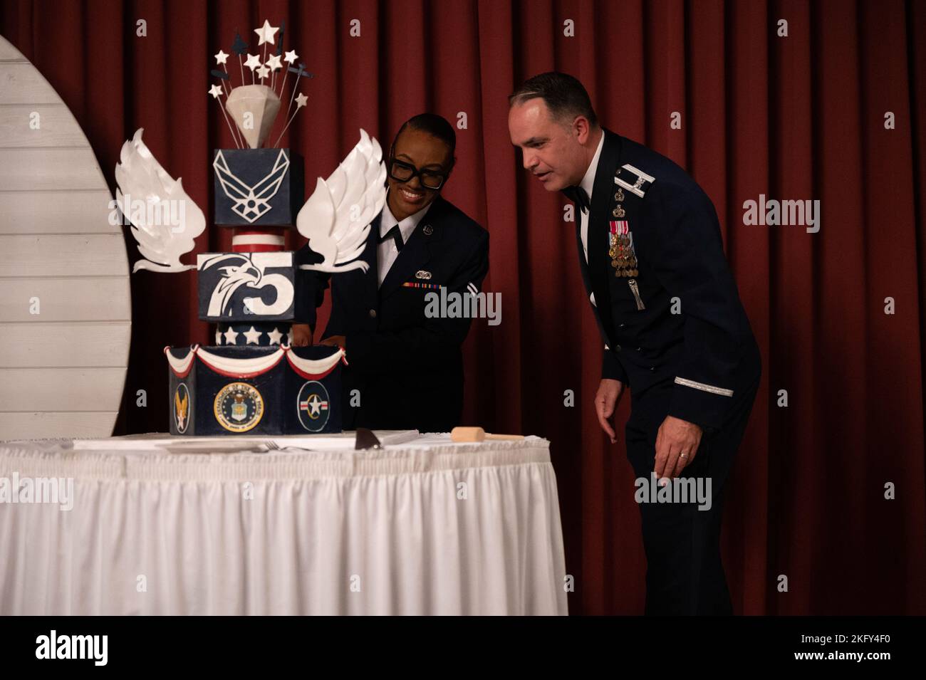 Col. Jason Vattioni, 377th Air Base Wing commander, helps Airman 1st ...