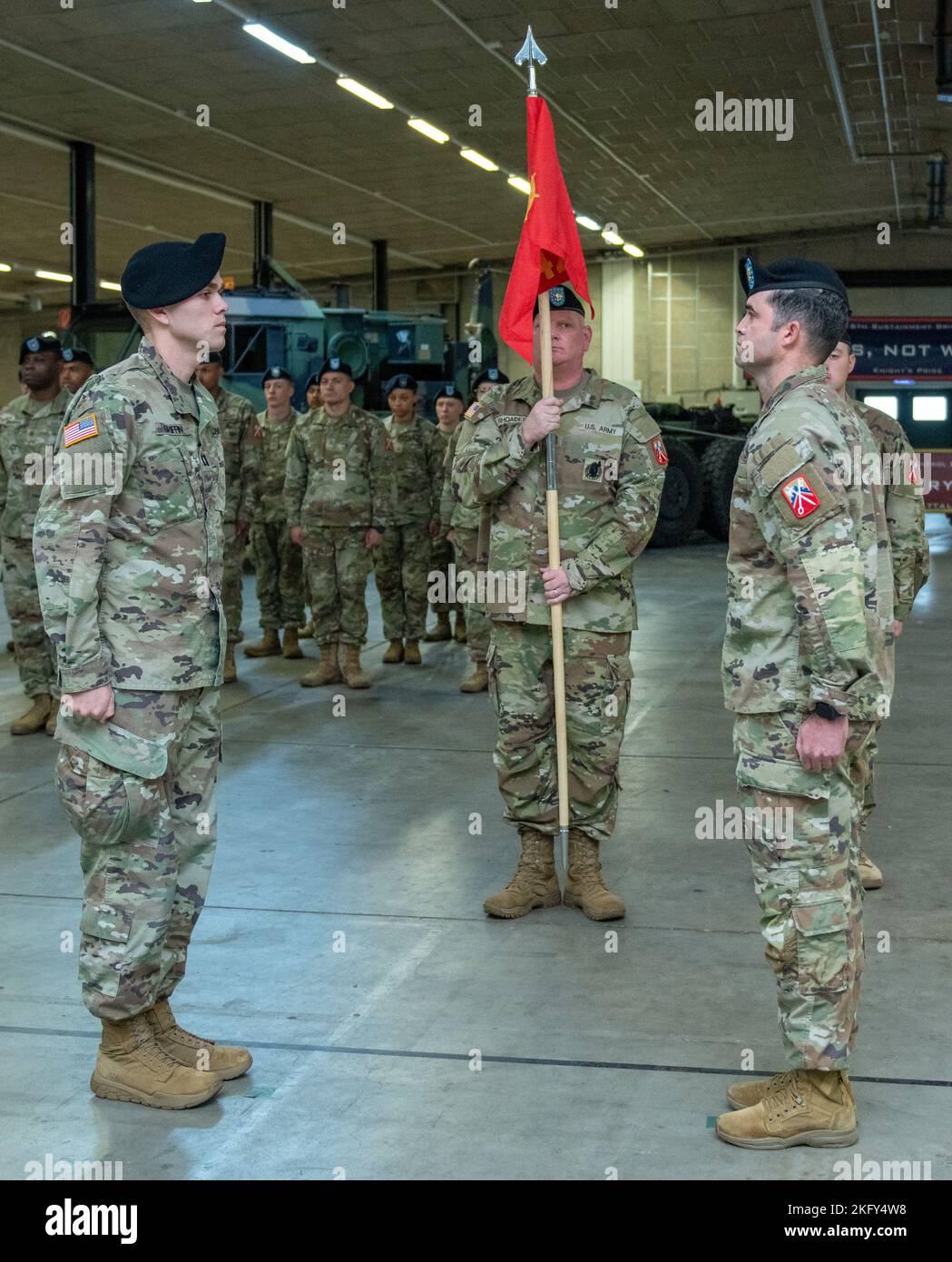 U.S. Army 1st Sgt. Eric A. Rhoades (center) prepares for the passing of ...