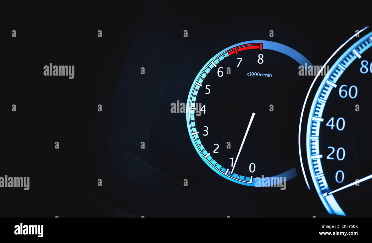 Round per minute (RPM) gauge illuminated on a car dashboard with copy ...