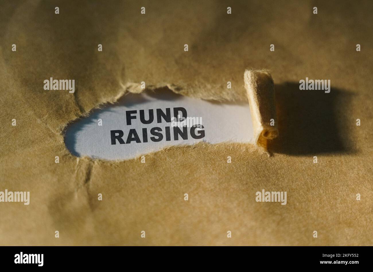 Economy and business concept. Torn paper in the middle of the sheet ...