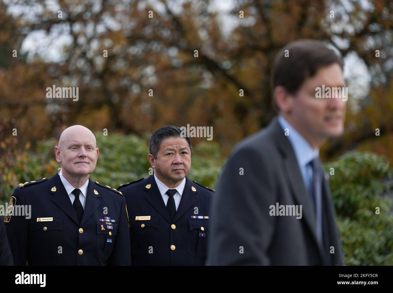Vancouver Police Chief Adam Palmer, back left, and deputy chief Howard ...