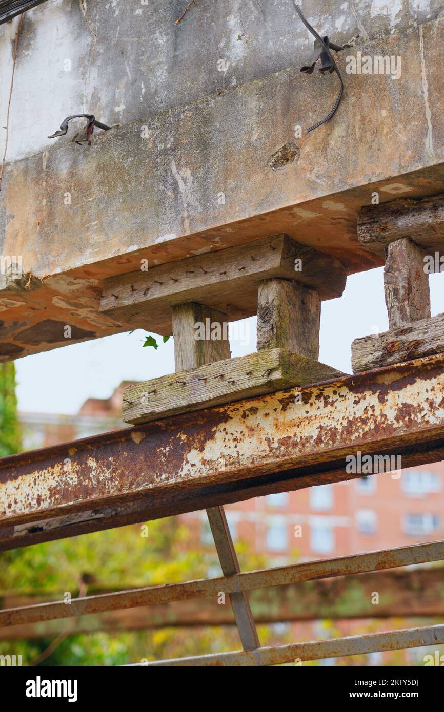 Bad cracked wooden support of metal beams of the bridge engineering ...