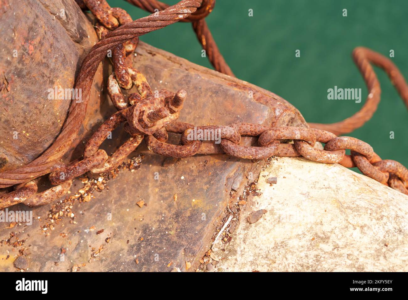 Rusty port anchor chain and old corroded iron hawser closeup Stock ...