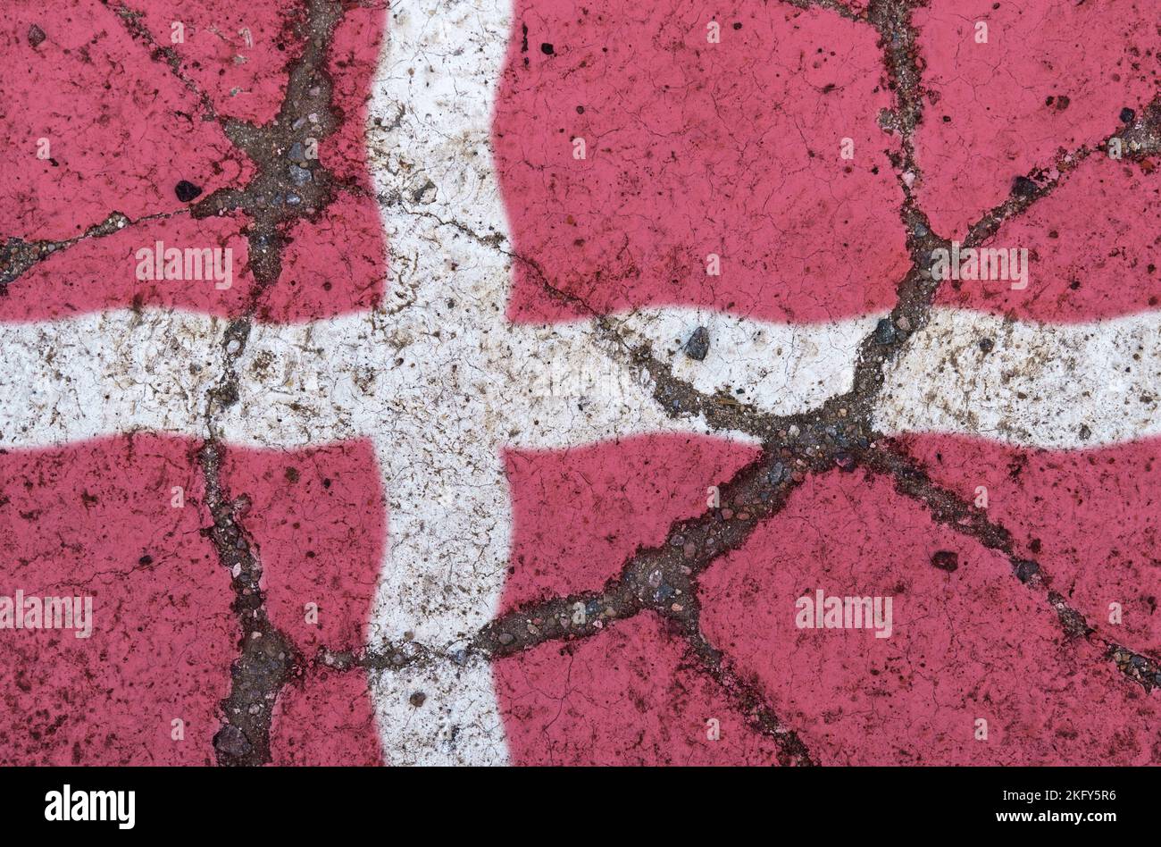 Denmark flag on cracked asphalt. The concept of crisis, default ...