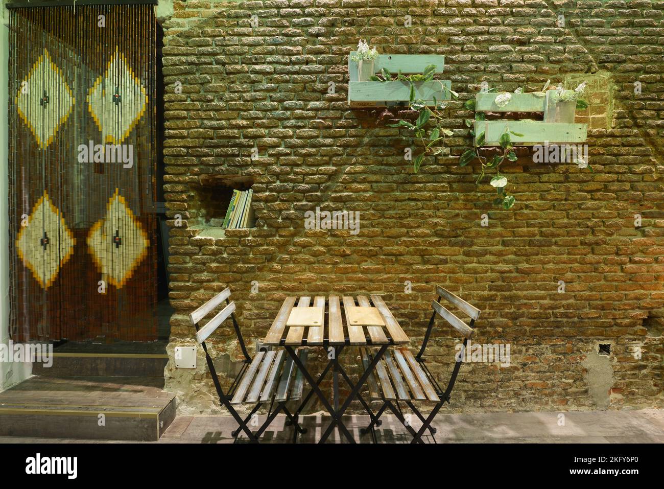 Dining table with wooden and metal folding benches in a bohemian style ...