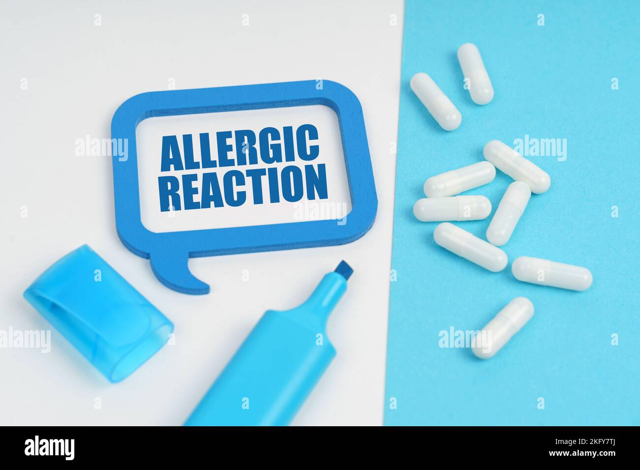 Medical concept. On the white and blue surface are a marker, tablets ...