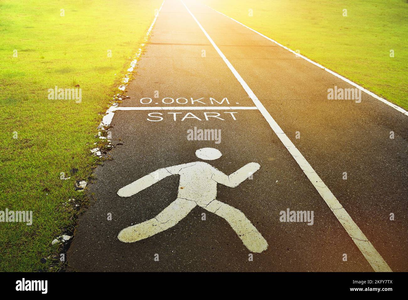 The line beginning on a paved road with sunlight coming from its ...