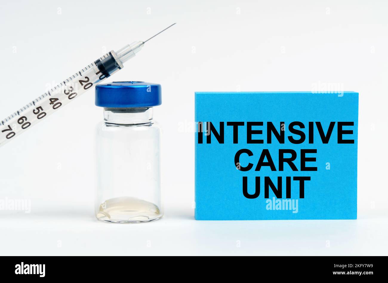 Medicine concept. On the table is a syringe, an injection and a blue ...