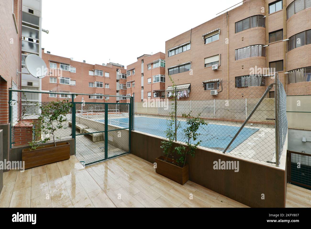 Common areas with a pool covered with a canvas for winter protection in ...