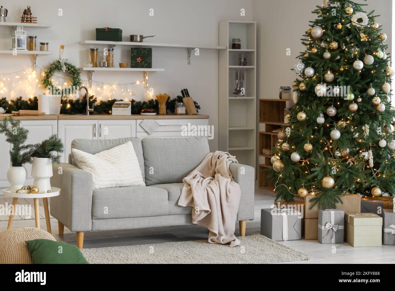 Interior of kitchen with sofa, Christmas tree and glowing lights Stock ...