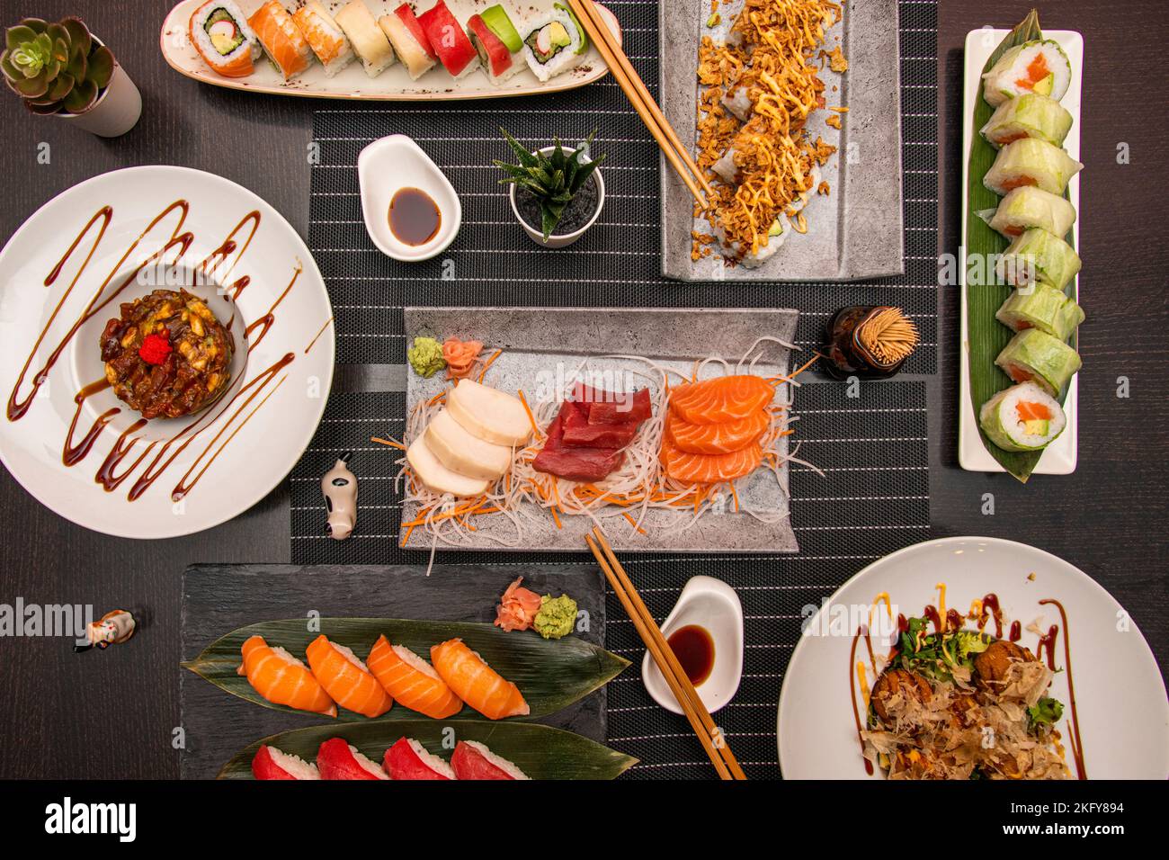 Set of Japanese food dishes with a lot of assorted sashimi, rice and ...