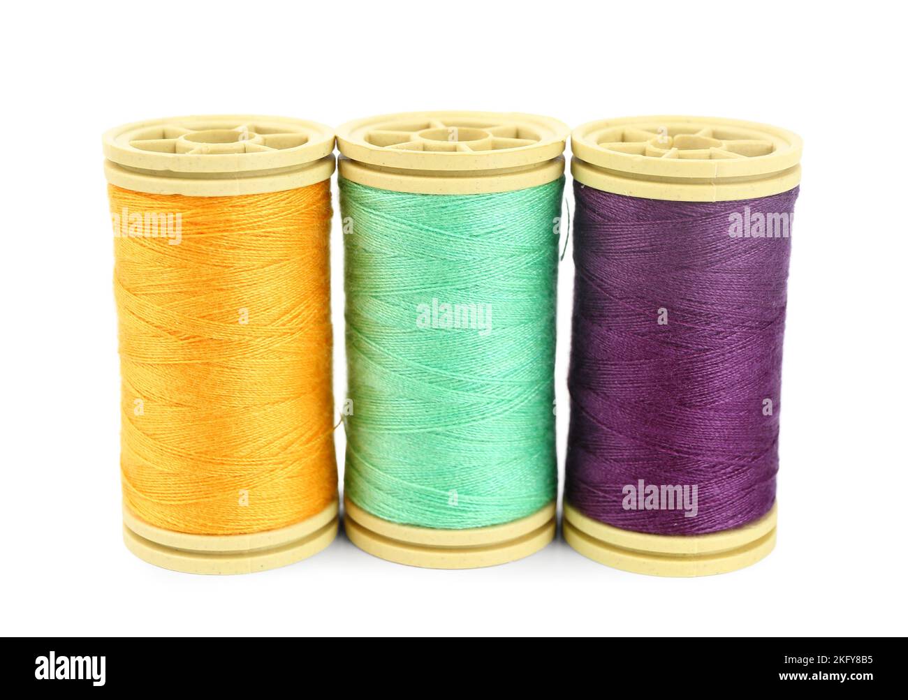 Colorful thread spools isolated on white background Stock Photo - Alamy