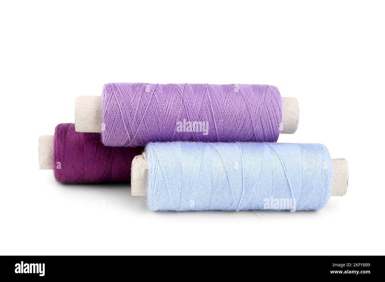 Colorful thread spools isolated on white background Stock Photo - Alamy